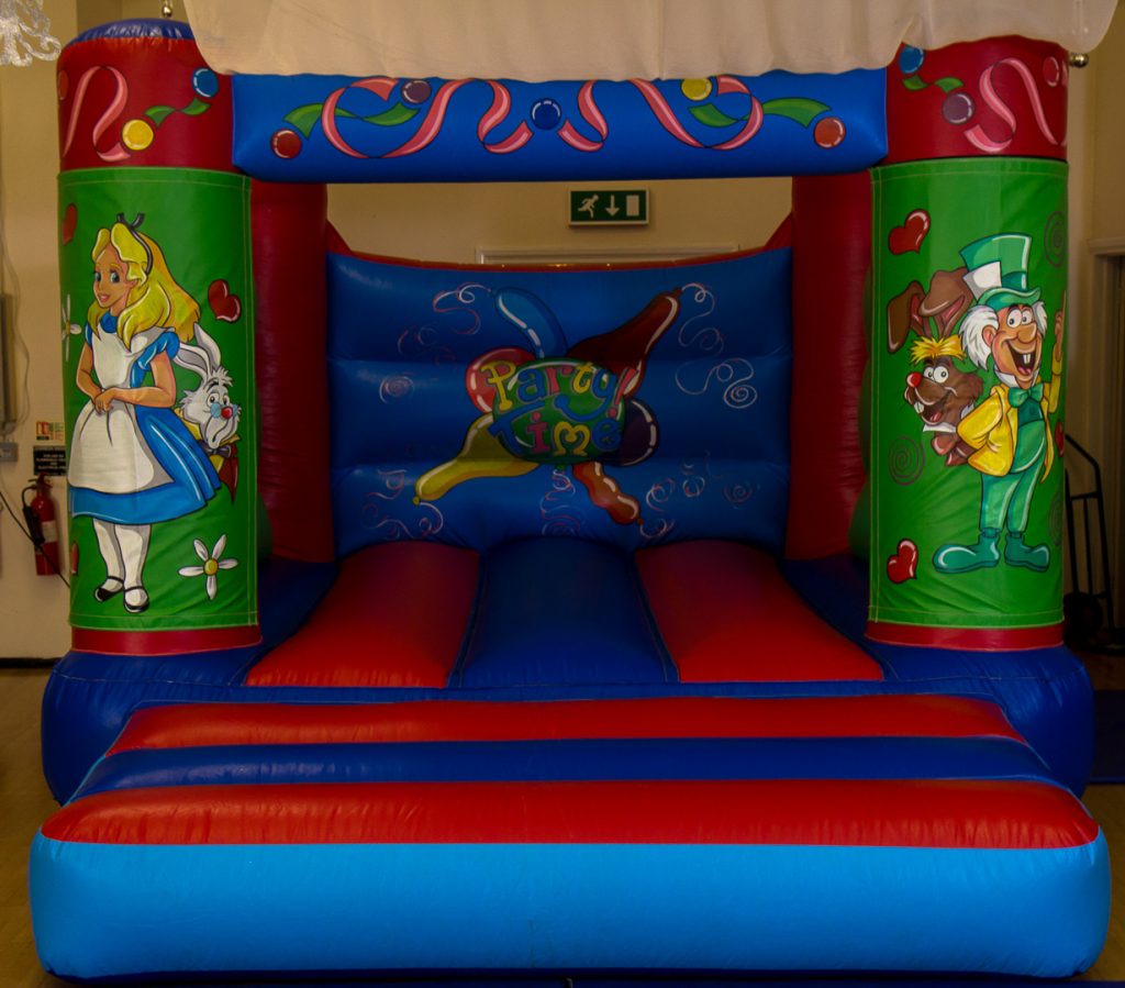 Alice in Wonderland Bouncy Castle Hire in Essex | Velcro Theme