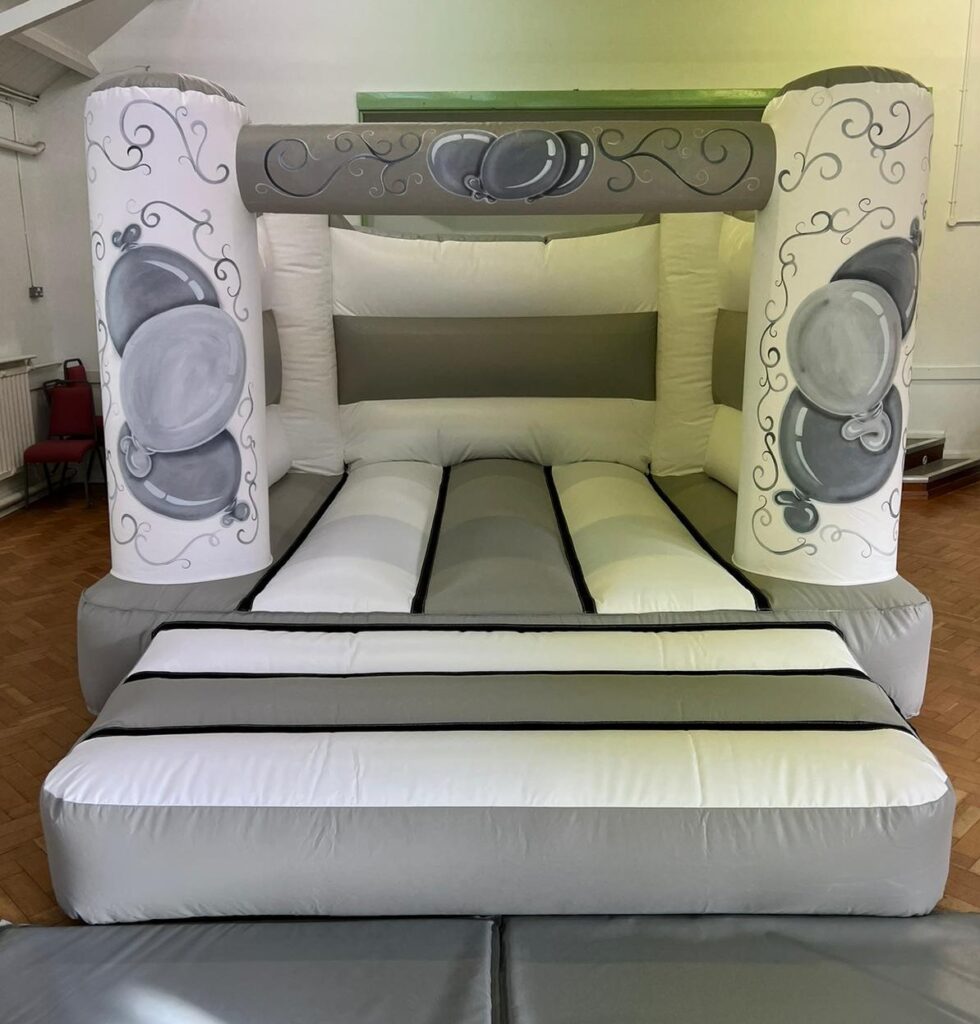 White & Silver Bouncy Castle Hire Essex | Celebration Castle